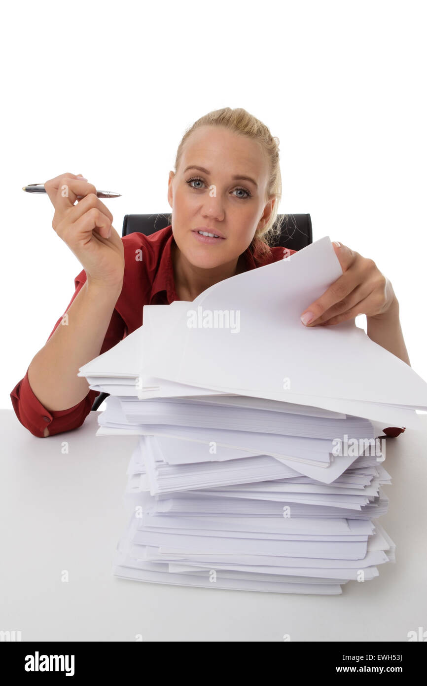 business woman looking at a stack of paper Stock Photo - Alamy