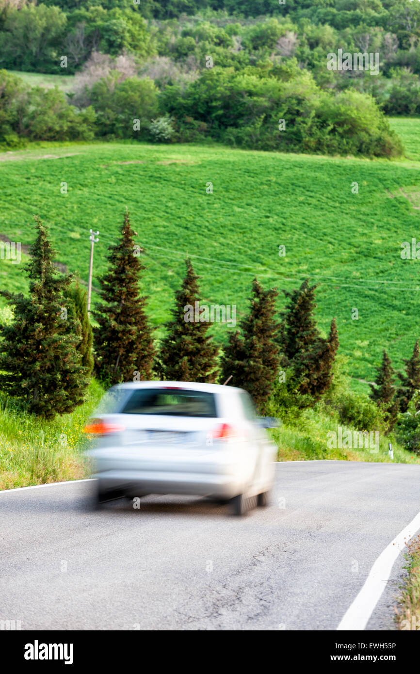 Car driving fast on country road, spring landscape Stock Photo - Alamy