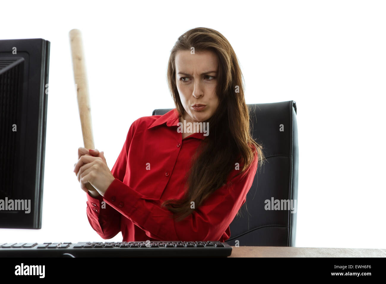 woman sitting at her desk holding a baseball bat getting mad at her ...