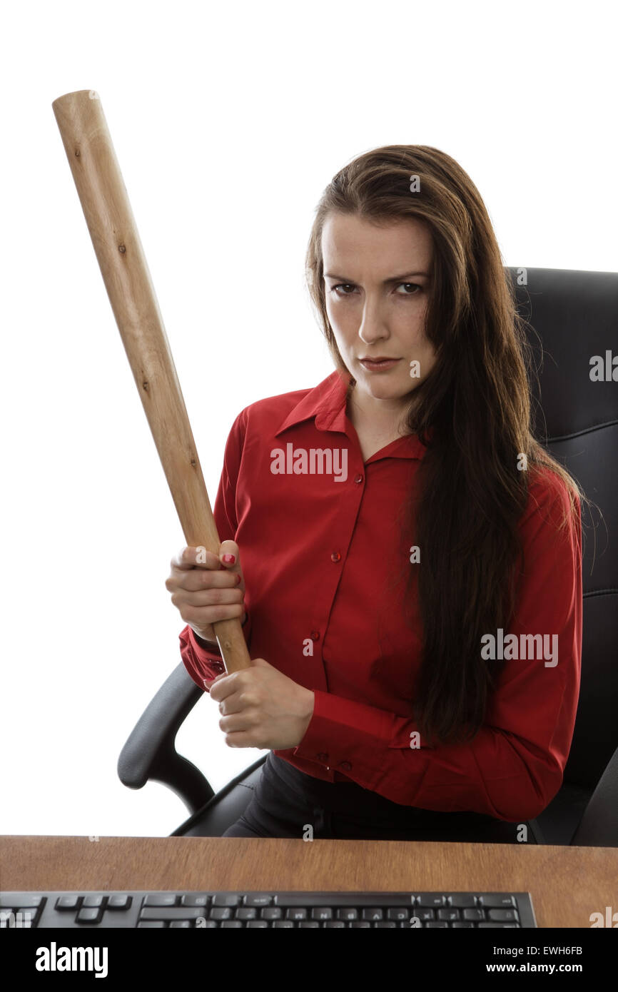 woman sitting at her desk holding a baseball bat getting mad at her ...