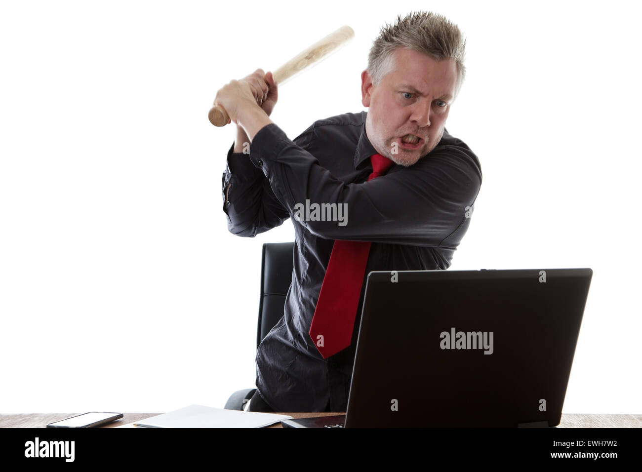 businessman getting very mad about to hit his computer with a baseball ...