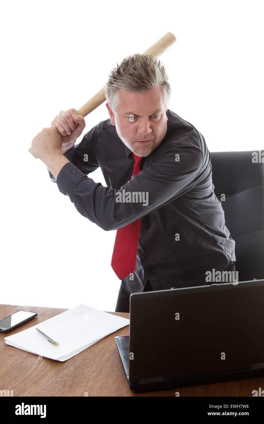businessman getting very mad about to hit his computer with a baseball ...