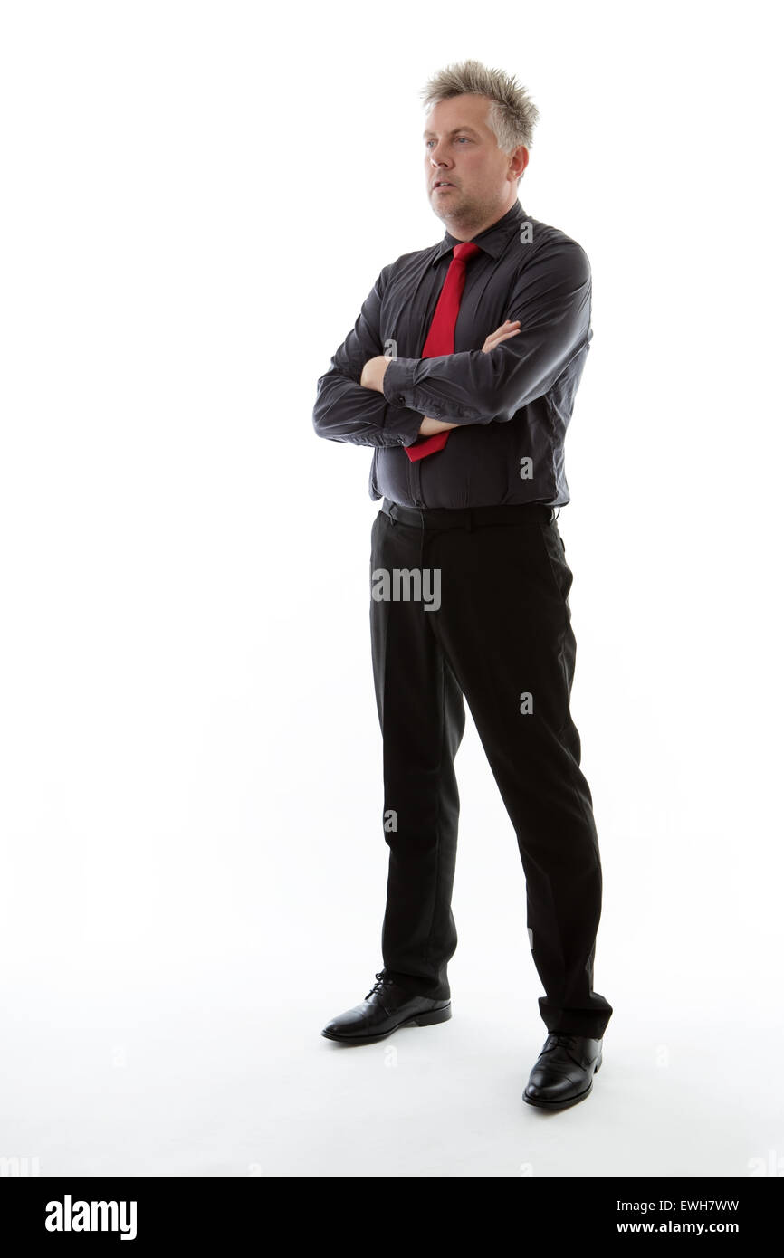 full length portrait of a man standing with his arm crossed Stock Photo ...