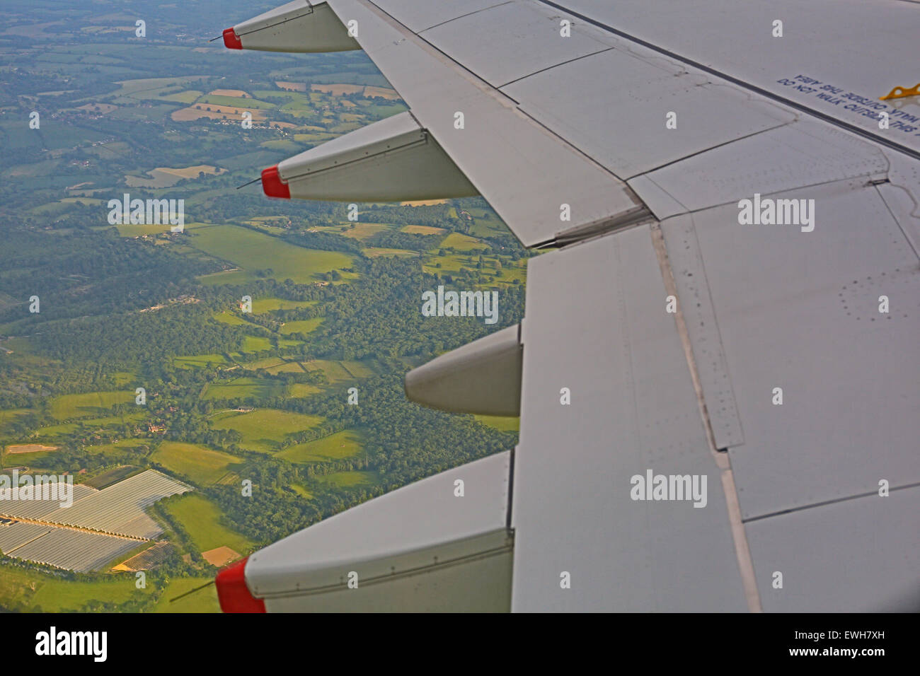 The wing of an aeroplane with ailerons Stock Photo - Alamy