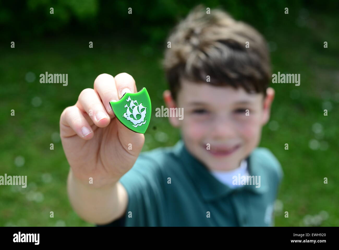 A boy holding a Blue Peter badge. Picture: Scott Bairstow/Alamy Stock ...
