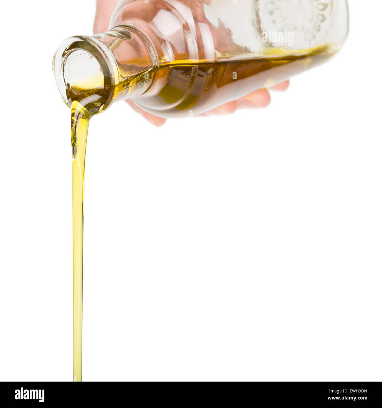Oil pouring from a bottle Stock Photo - Alamy