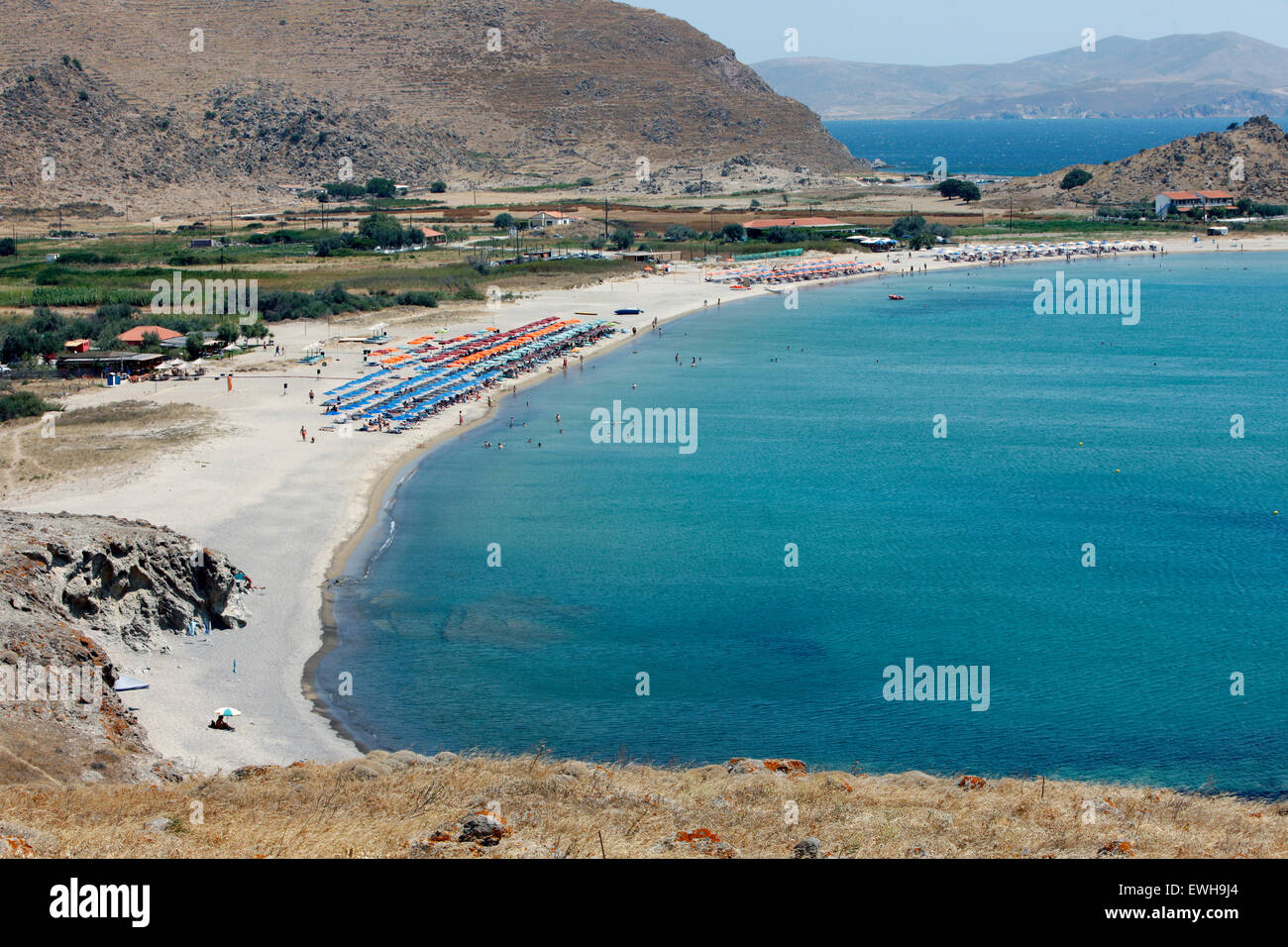 Wide view of Thanos village bay and beach full of Umbrella kiosks ...