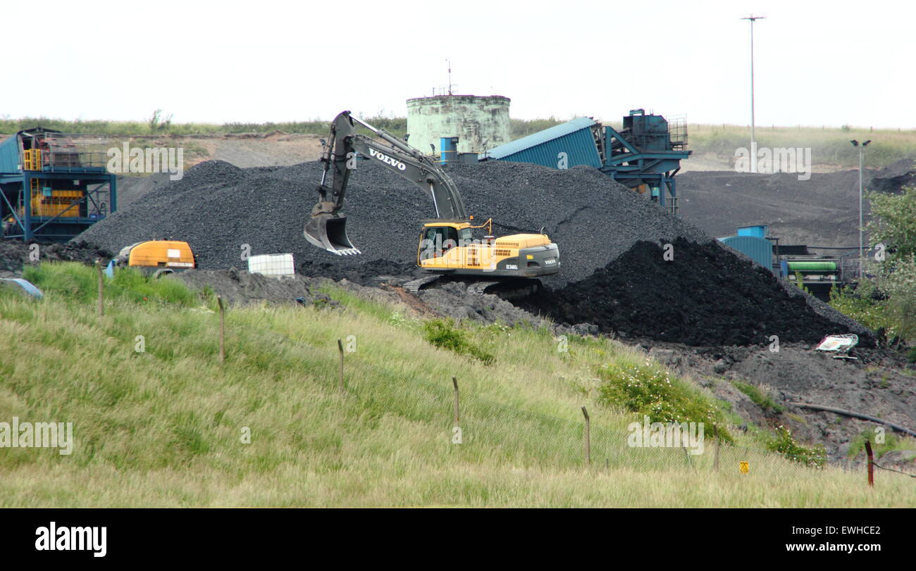 A man operates a digger at Thoresby Colliery, Nottinghamshire. Thoresby ...