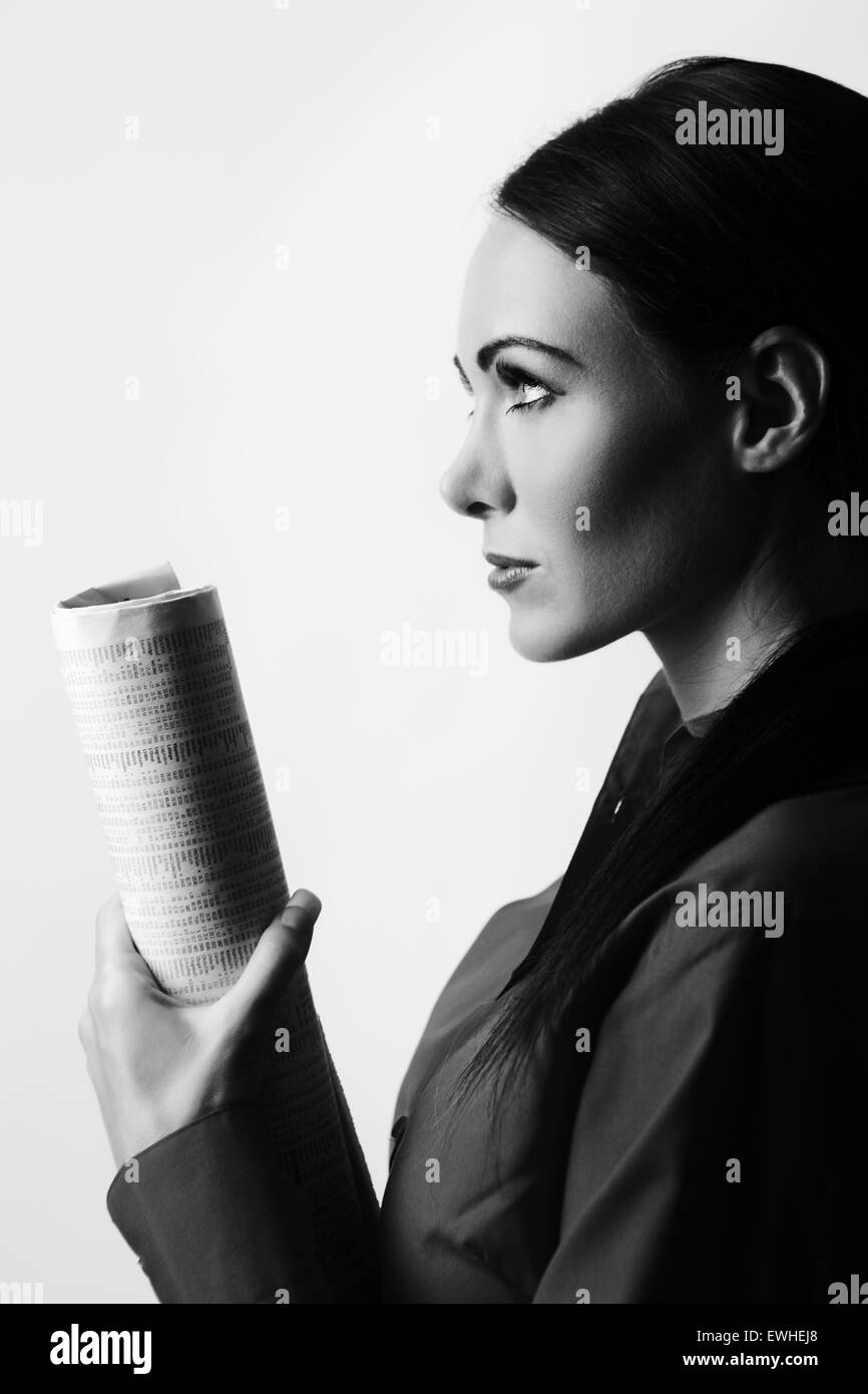 woman holding a financial paper showing stock and shares Stock Photo ...