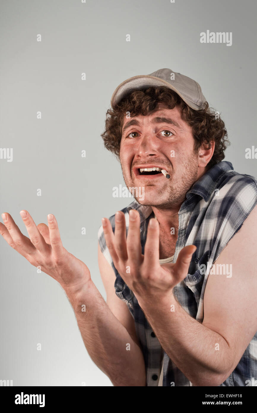 Pleading redneck throws his arms in the air in confusion and disgust ...