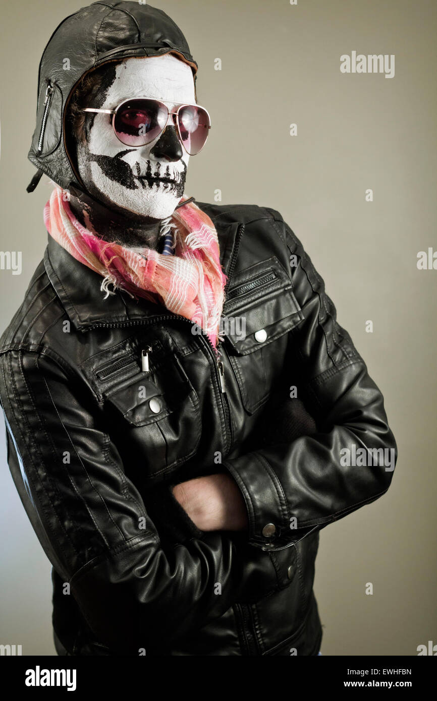 Confident aviator with face painted as human skull Stock Photo - Alamy