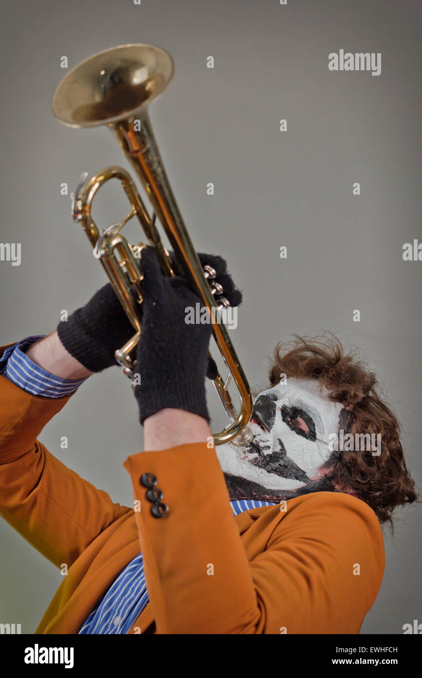 Professional trumpet player with face painted as human skull Stock ...