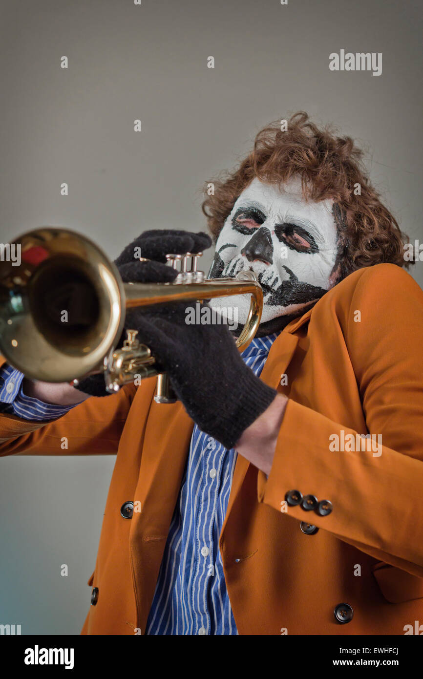 Professional trumpet player with face painted as human skull Stock ...