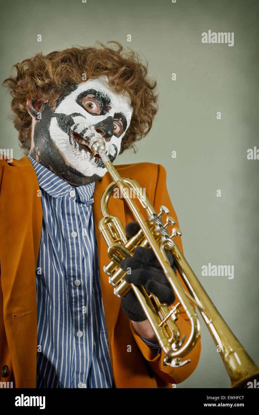 Professional trumpet player with face painted as human skull Stock ...