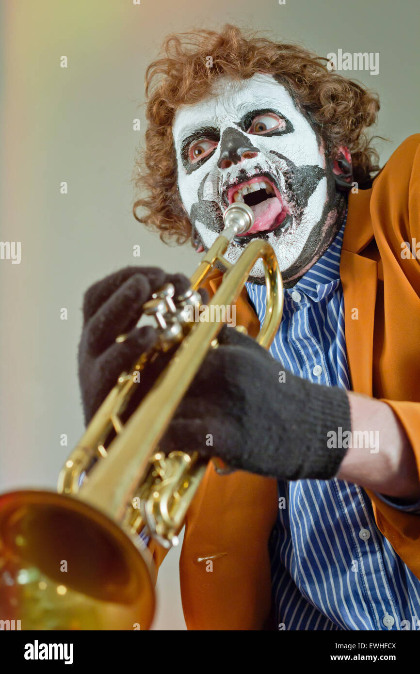 Professional trumpet player with face painted as human skull Stock ...
