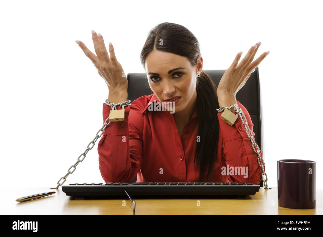 businesswoman chained to her office desk at work Stock Photo - Alamy