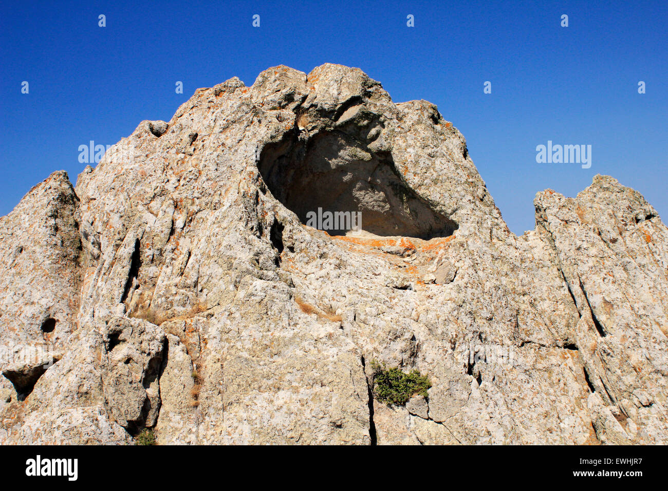 Isolated rocky cave holes seen from the rough ascending footpath ...