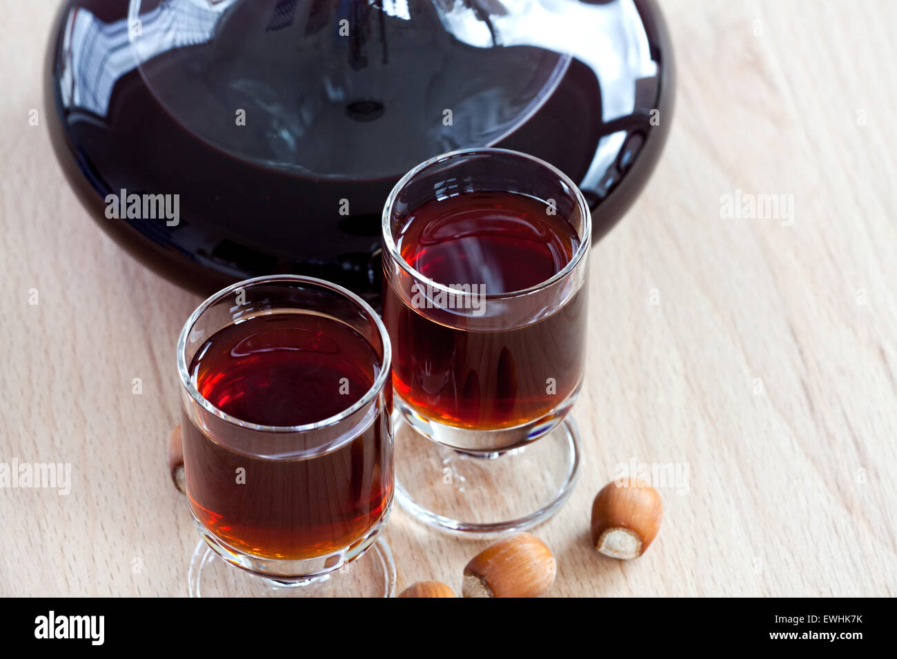 Close up view of homemade hazelnut liqueur in a glass carafe on a ...