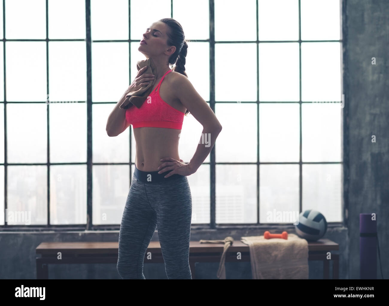 Wow, that felt good. A woman wipes hard-earned sweat off her neck after ...