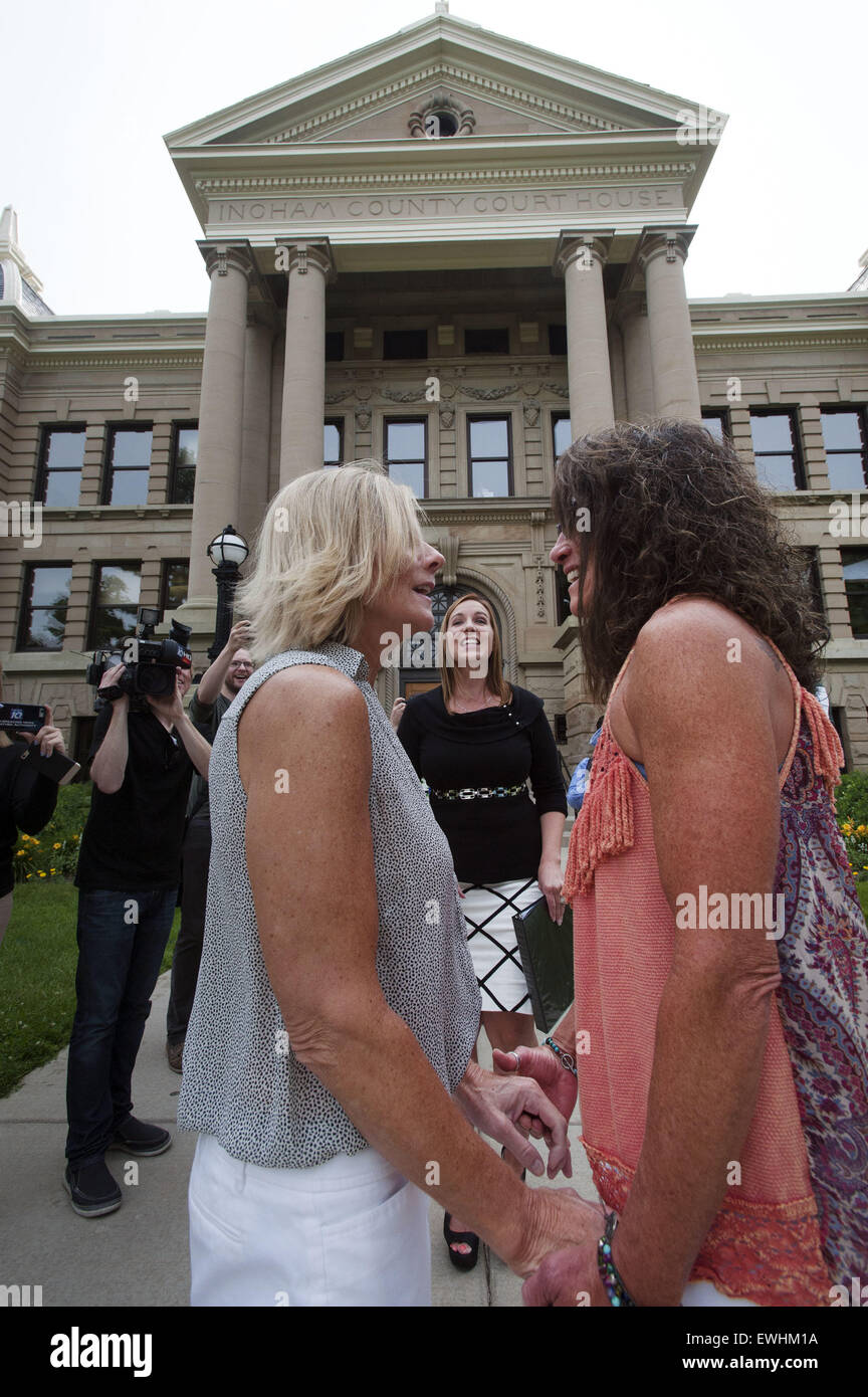 Mason, MI, USA. 26th June, 2015. Lee Chaney, left, and Dawn Chapel get ...