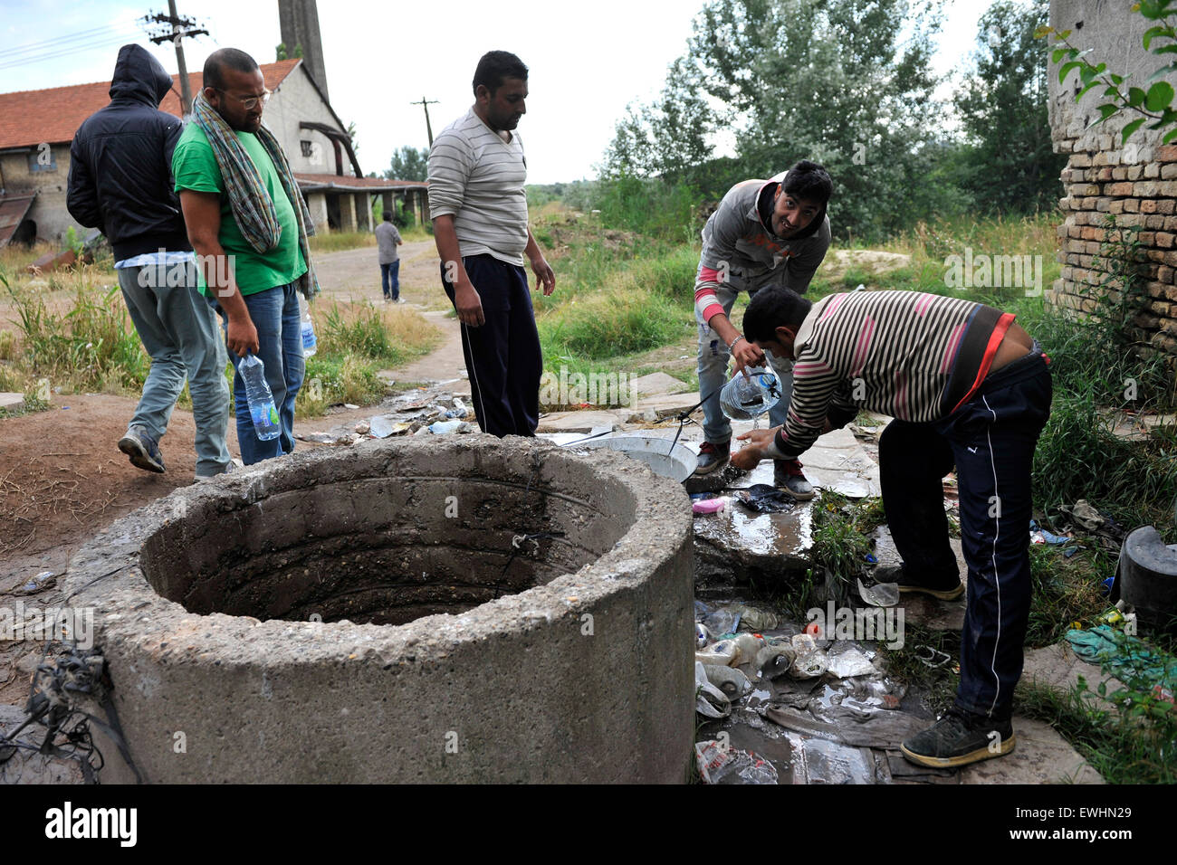 Dozens of migrants live in an abandoned factory near the town of ...