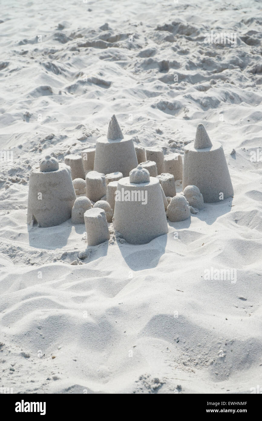 Small sand castle on the sandy beach Stock Photo - Alamy