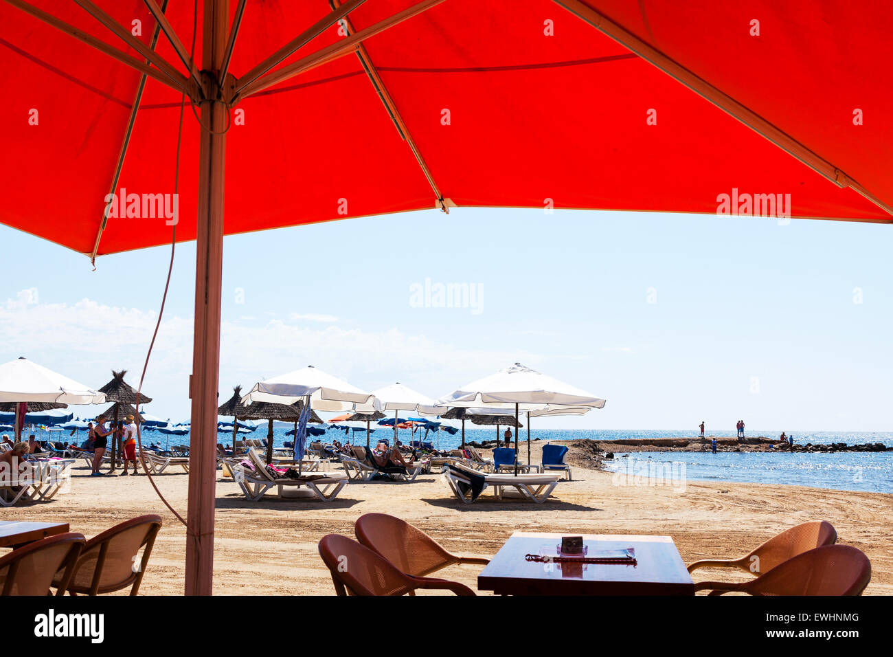 Under parasol on beach resort Santa Eulalia Del Rio Ibiza Spain Spanish ...