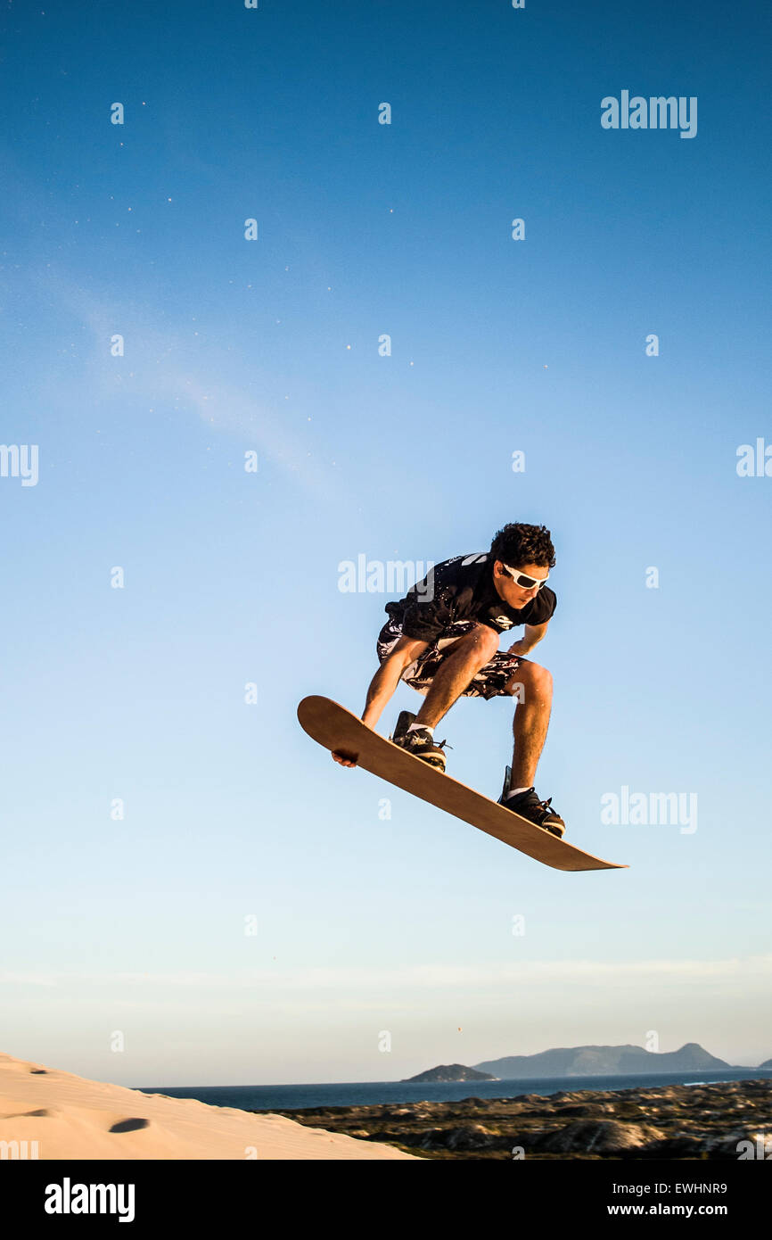 Sandboarding on the dunes of Joaquina Beach. Florianópolis, Santa ...