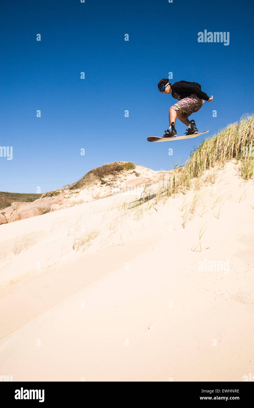 Sandboarding on the dunes of Praia Grande. Laguna, Santa Catarina ...