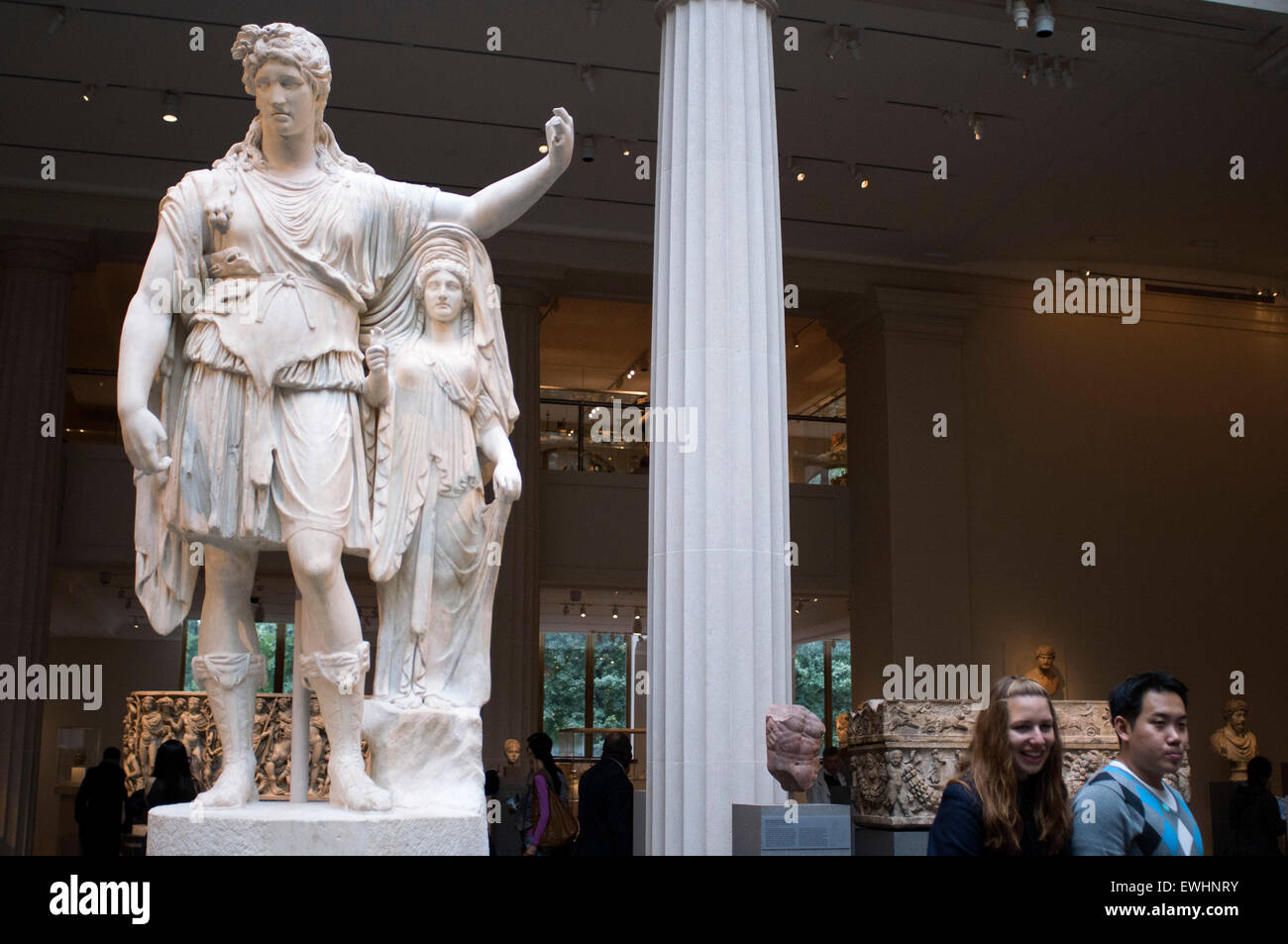 Marble statue of Dionysos leaning on an archaistic female figure. Roman ...
