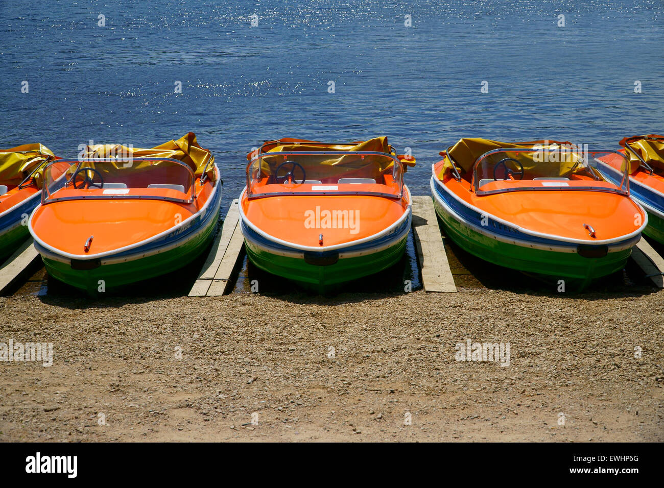 Pedal boats side by side on the shores of Titisee Stock Photo - Alamy