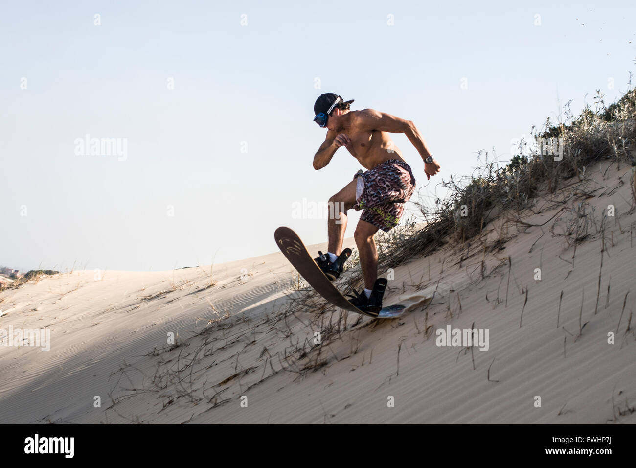 Sandboarding on the dunes of Campo Bom Beach. Jaguaruna, Santa Catarina ...