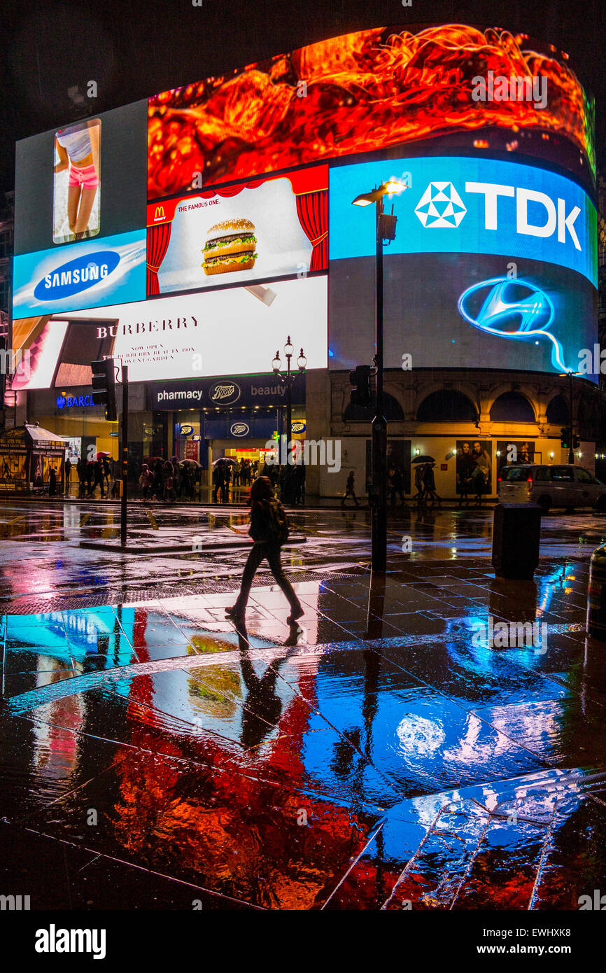 Rain reflects Piccadilly Circus lights in Central London Stock Photo ...