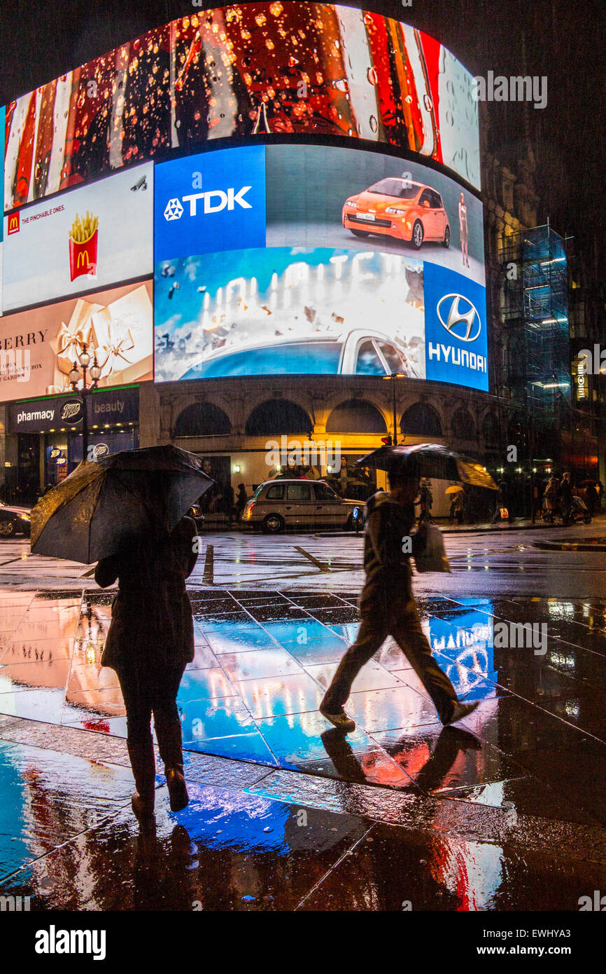 Rain reflects Piccadilly Circus lights in Central London Stock Photo ...