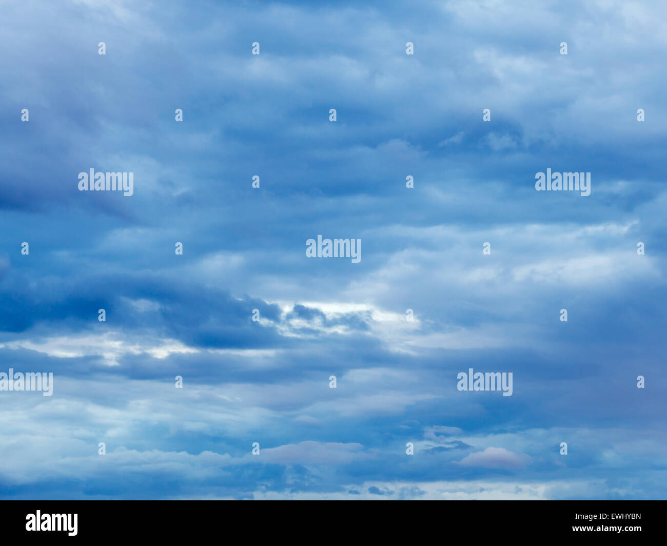 dense blue overcast in summer evening sky Stock Photo - Alamy