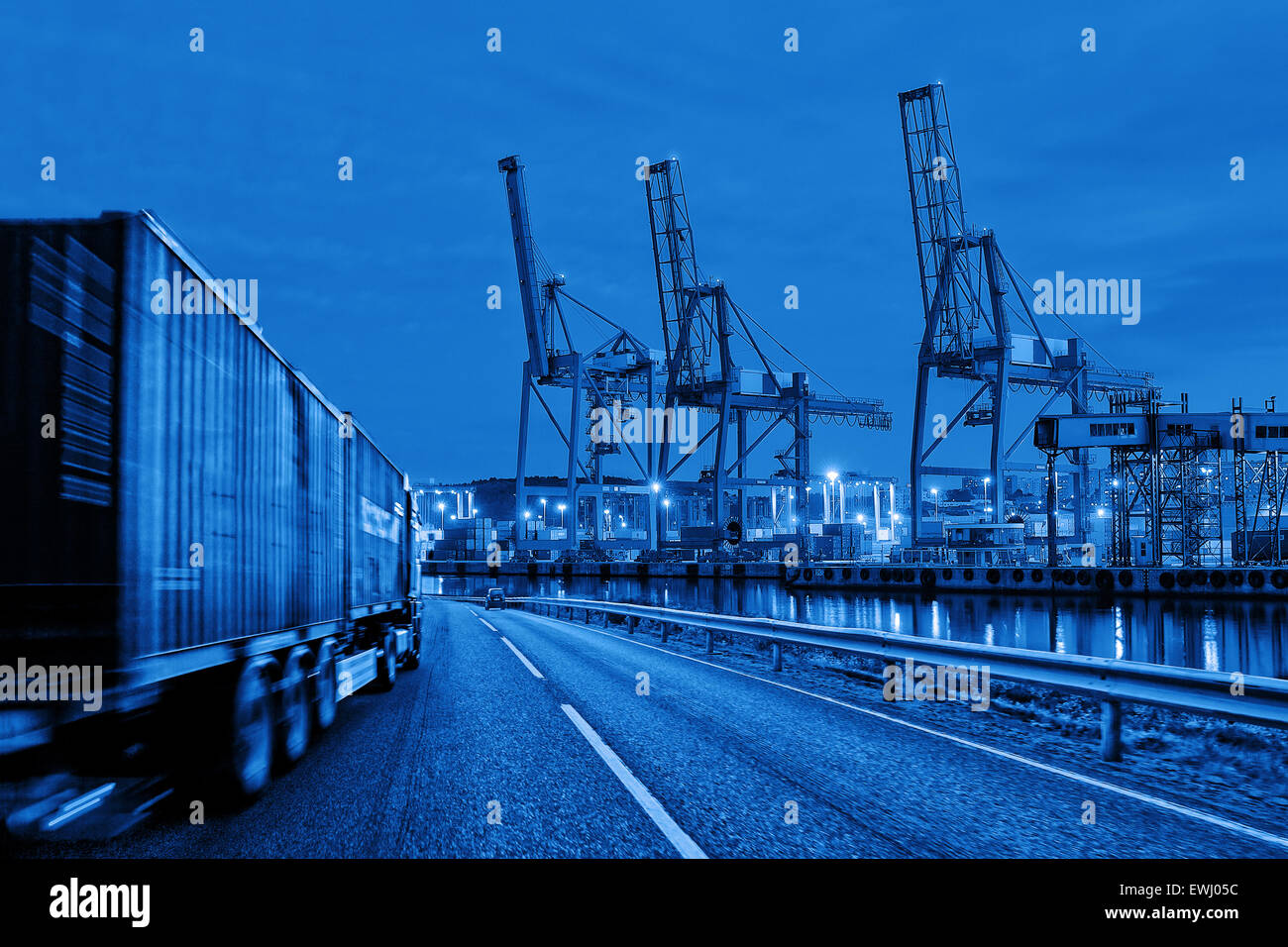 Truck on road to port - Shipping concept Stock Photo - Alamy