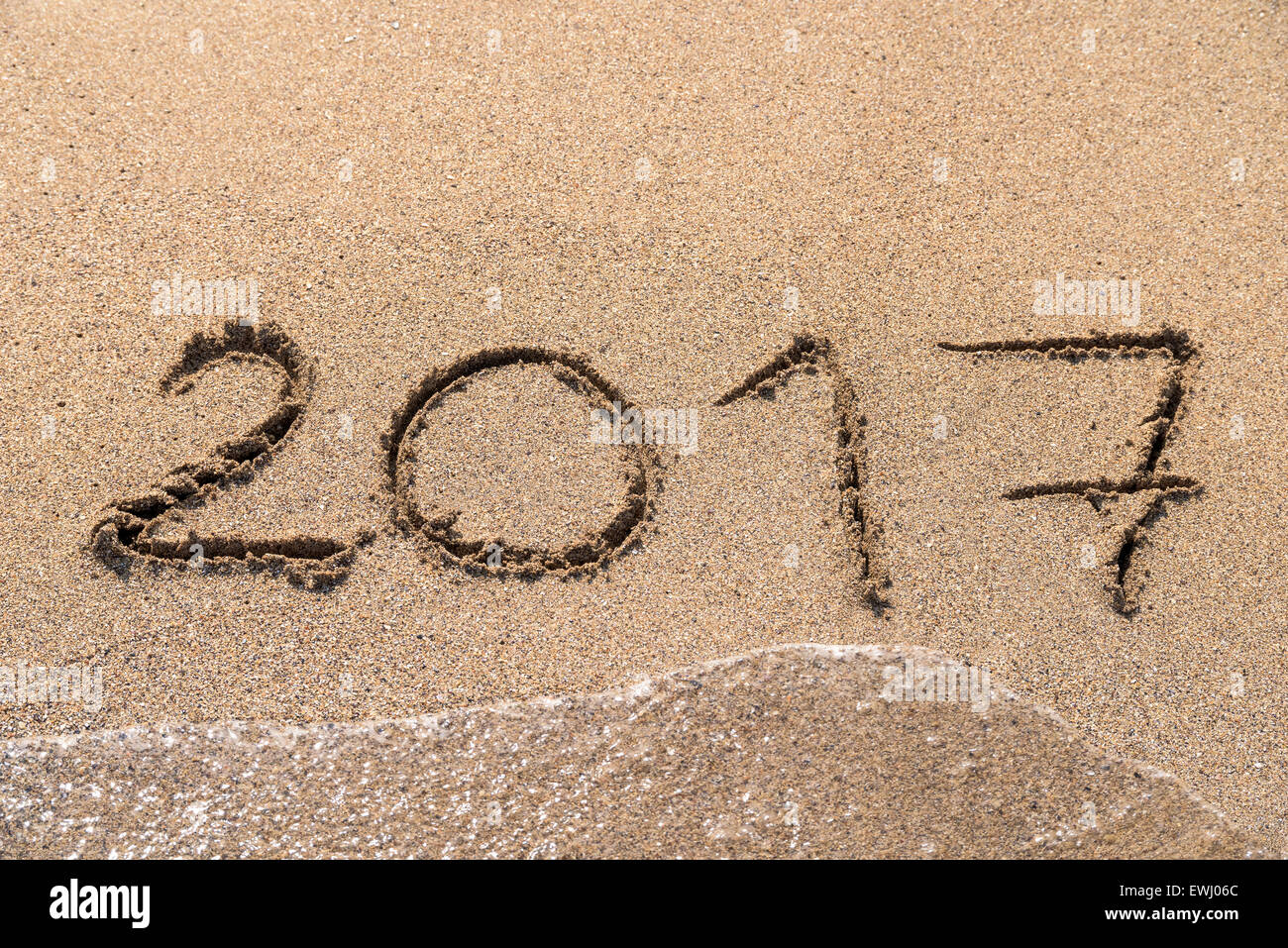 Year 2017 Written On Beach Sand Stock Photo - Alamy