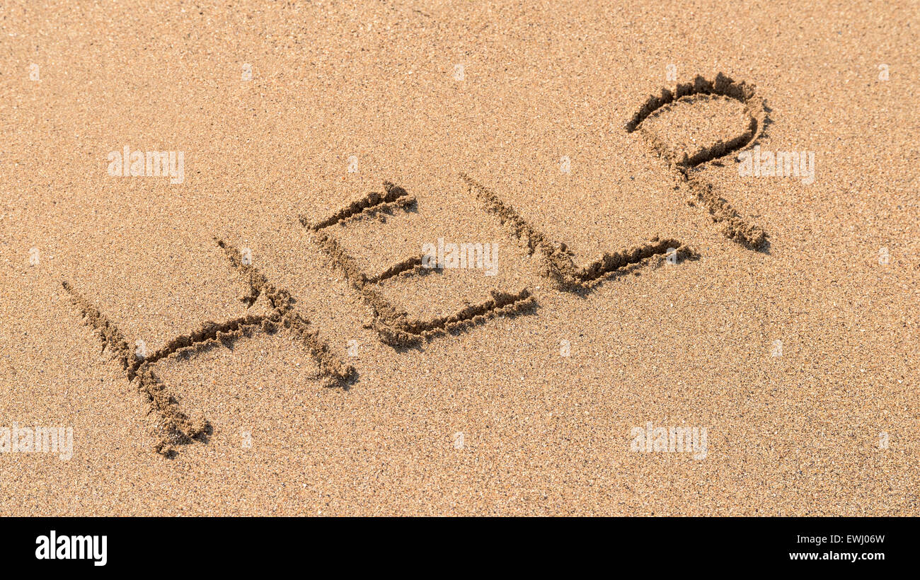 Save Me Sign Drawn On Beach Sand Stock Photo - Alamy