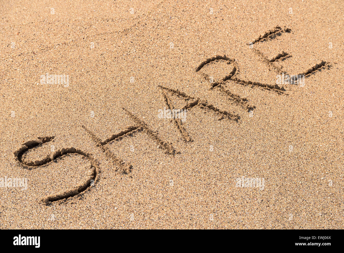 Share Sign On Beach Sand Stock Photo - Alamy