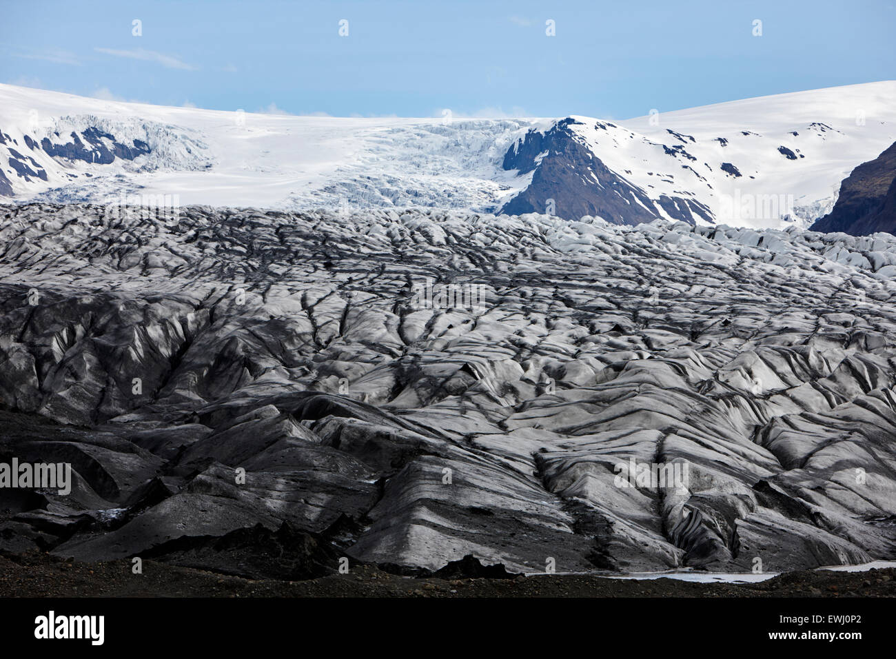 ash covered Skaftafell glacier Vatnajokull national park in Iceland ...