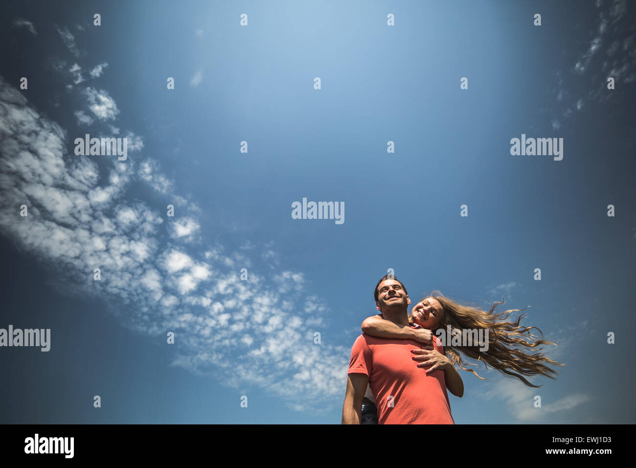 Girl hug her boyfriend Stock Photo - Alamy