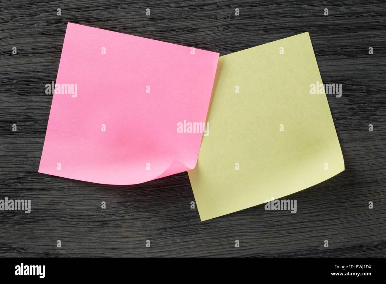 yellow and purple sticky notes on wooden table Stock Photo - Alamy