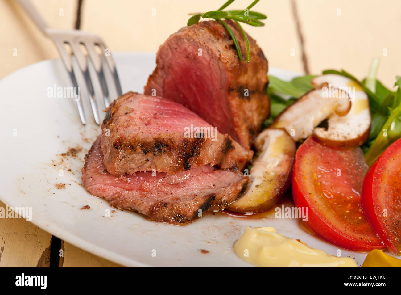 beef filet mignon grilled with fresh vegetables on side ,mushrooms ...