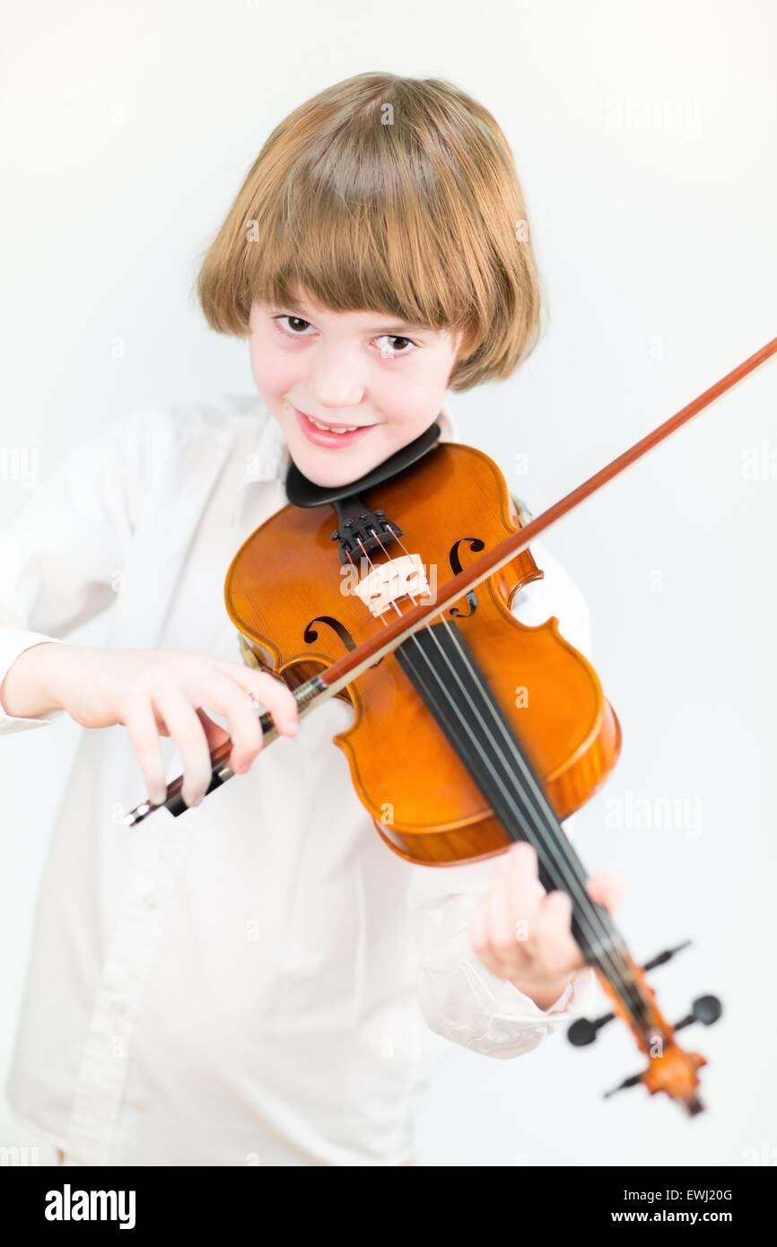 Happy child playing violin Stock Photo - Alamy