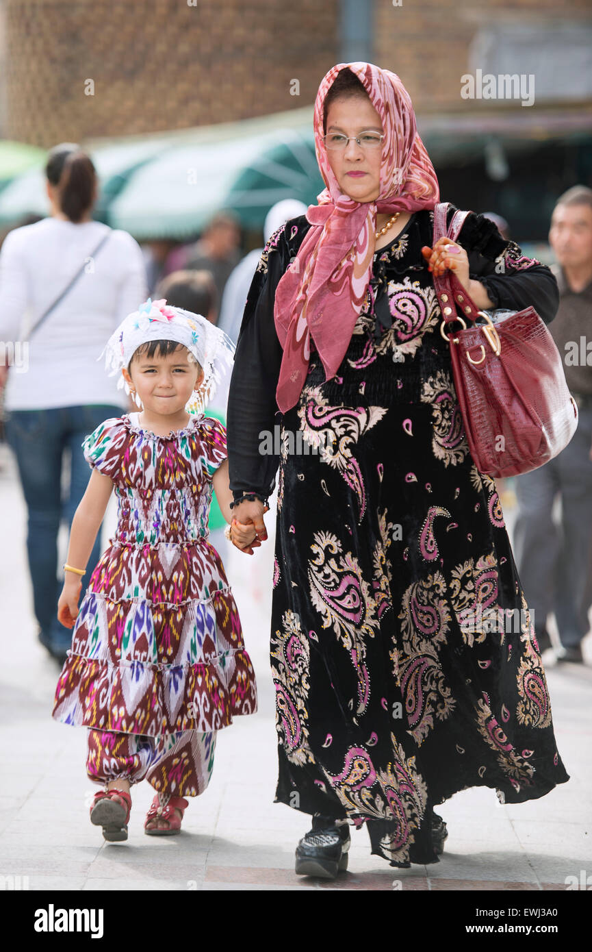 People walk in the street in Ürümchi city, Xinjiang Uyghur Autonomous ...