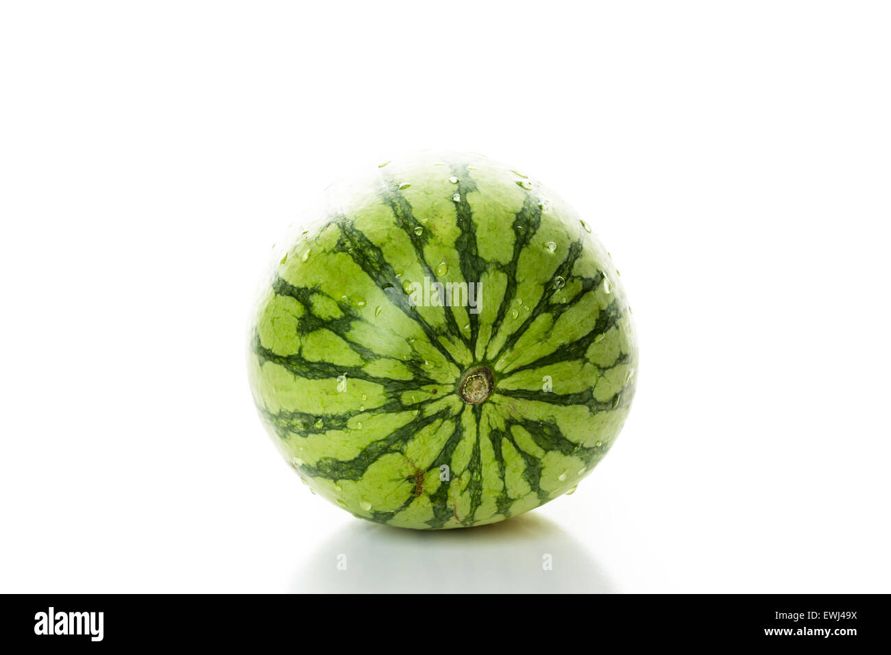 Whole organic mini watermelon on a white background Stock Photo - Alamy