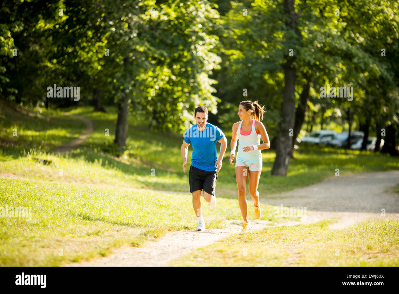 Young couple running Stock Photo - Alamy