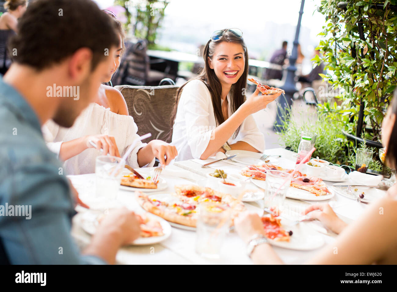 Young people by the table Stock Photo - Alamy