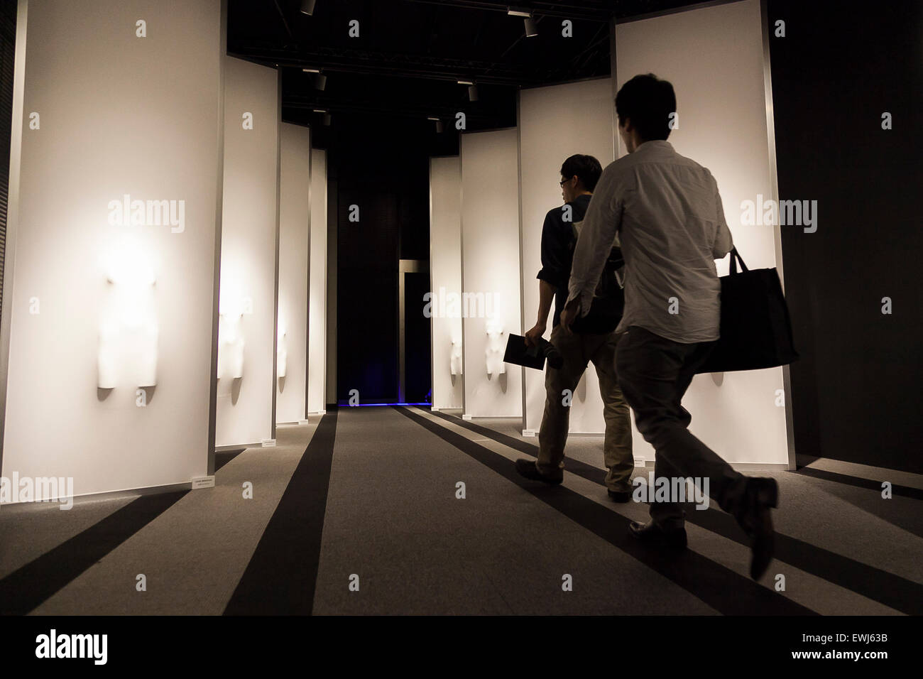 People pass between the dummies illuminated by the new spotlights TOLSO ...