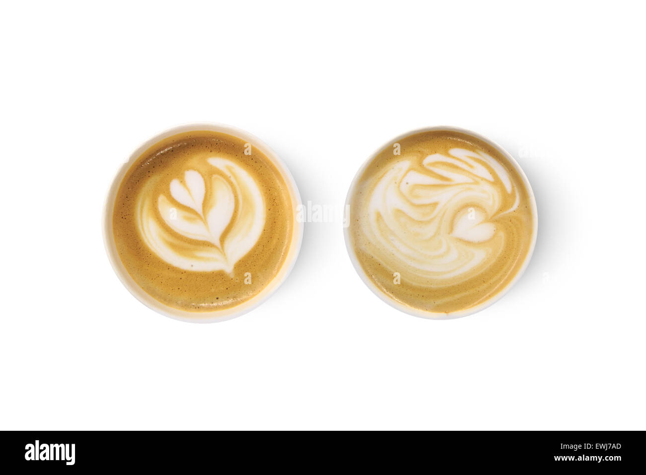 Top view of two latte art coffees with heart figure, isolated on white ...